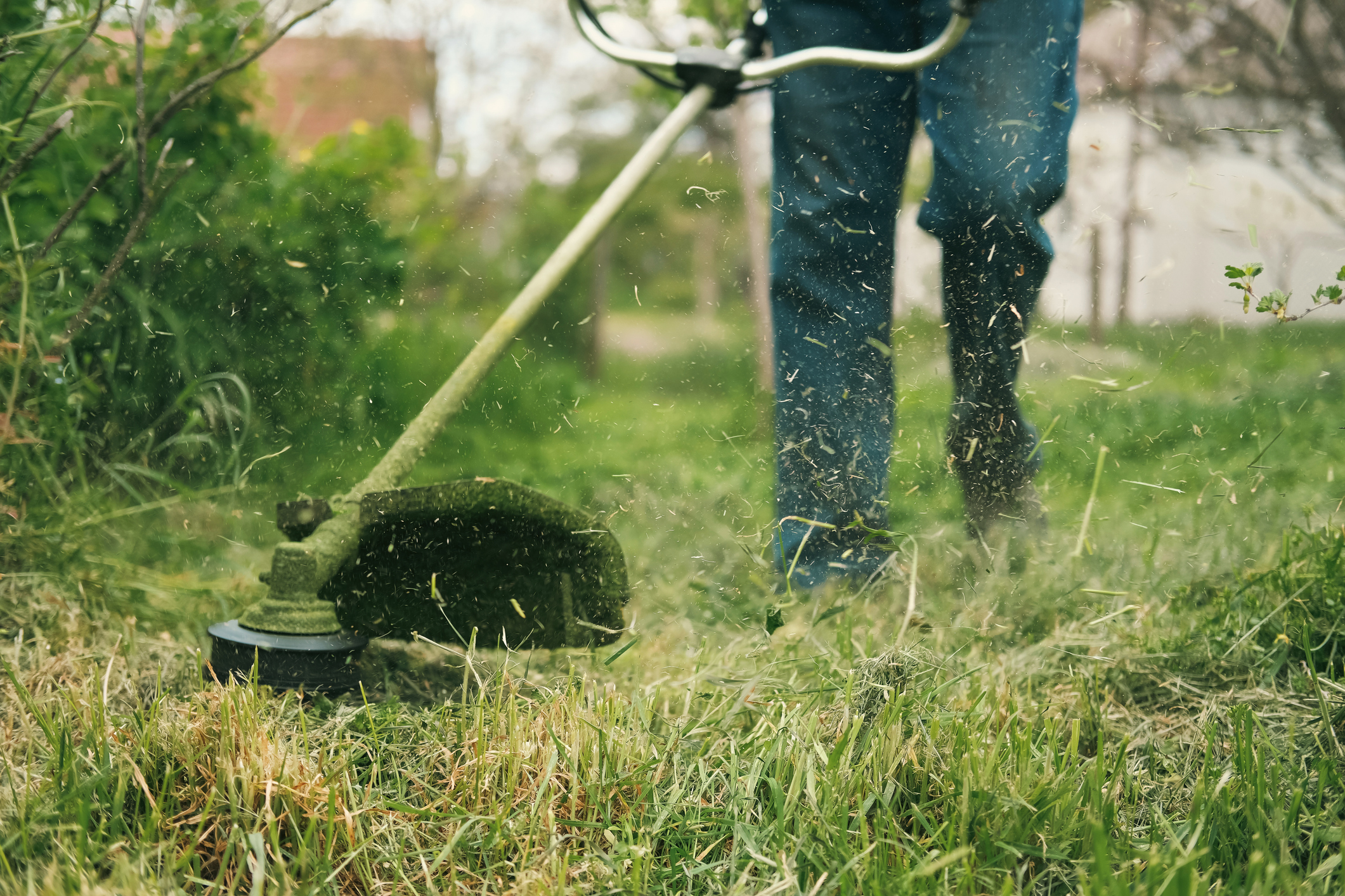 Man working with grass cutter. | Blain's Farm & Fleet