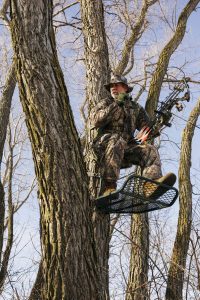 Bowhunter In Tree Stand in Winter | Blain's Farm & Fleet Blog